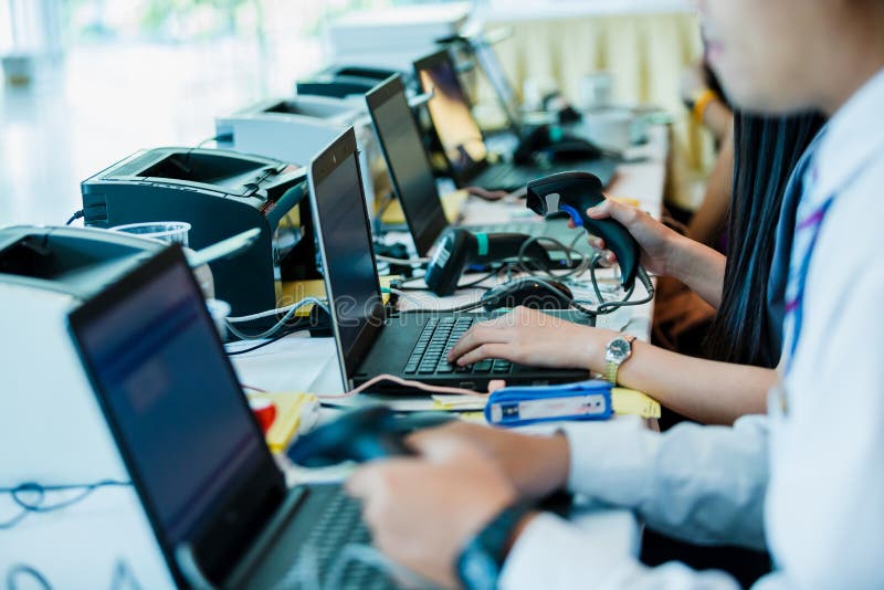 Staffs are Typing Information with Mouse for Register or Input Data ...