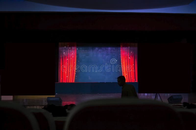 Stage Blue Center Screen with Red Curtains in Auditorium Stock Image ...