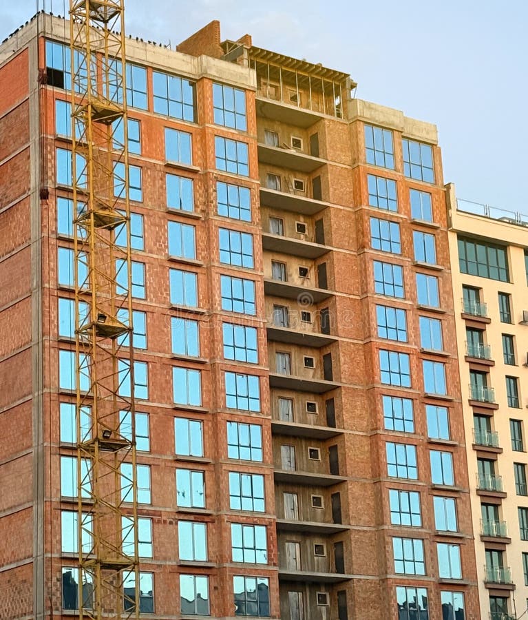 Multi-storey Residential Building Against a Cloudy Sky. Stock Image ...