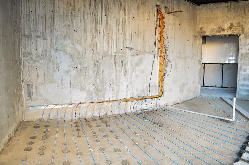 The Stage of Installation of a Cable for a Warm Floor on Concrete, a ...
