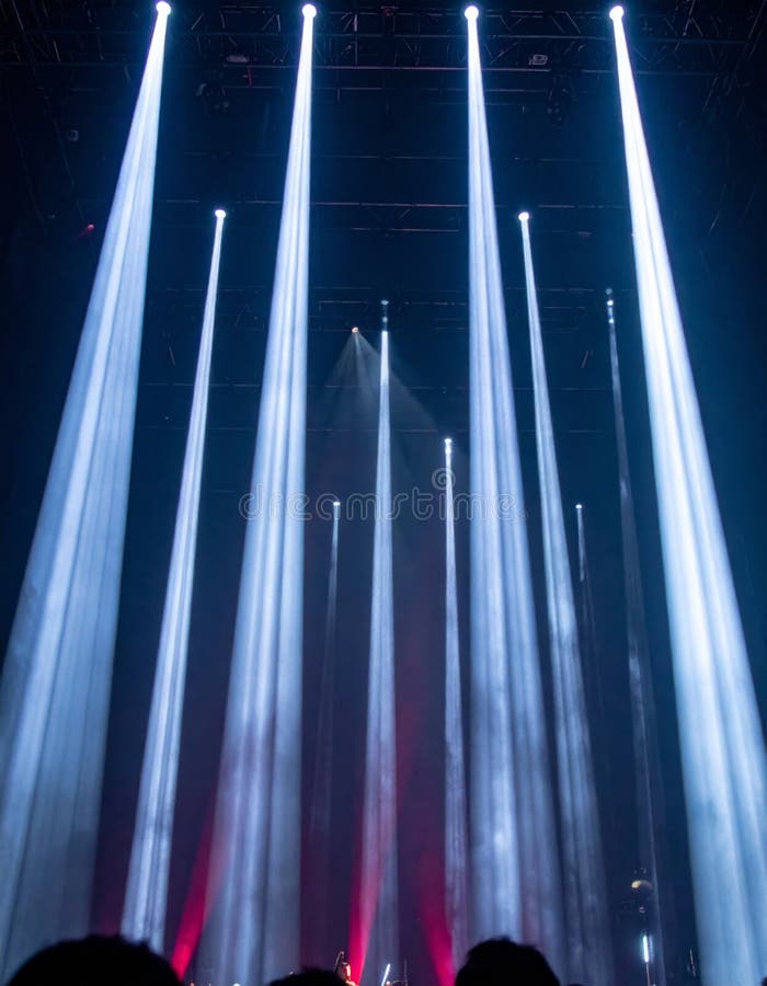 Stage Lighting with Powerful White Beams and Red Accents at a Concert ...