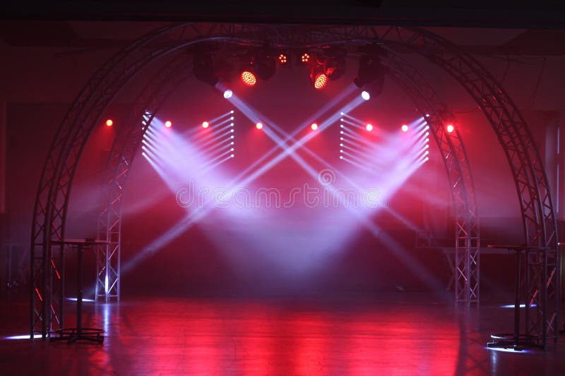 A Stage with Lights and a Red Arch Stock Image - Image of jockey, color ...