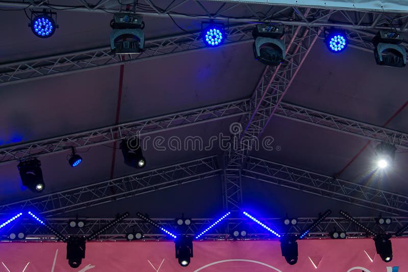 Stage Lights and Rotating Heads Hang Above the Stage Colored Light ...