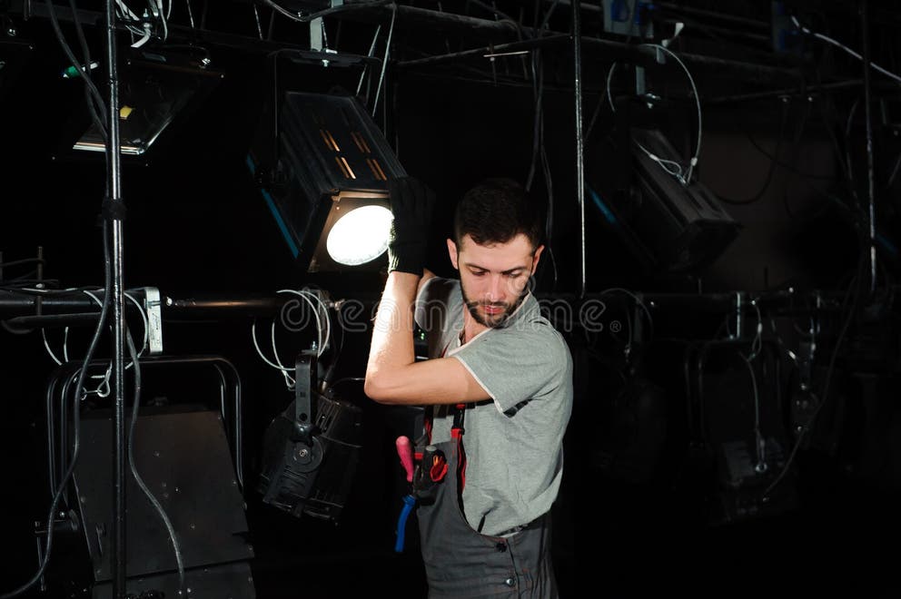 The Stage Worker Sets Up the Lights. Stock Image - Image of electrician ...