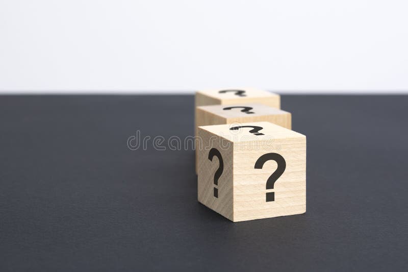 Staggered Row of Three Wooden Blocks with Question Marks Black on Black ...