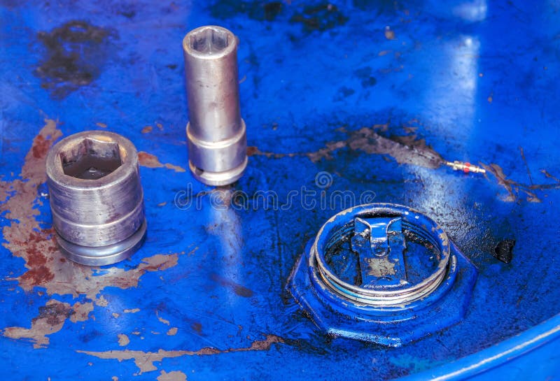 Grease and Oil Stained Pneumatic Wrench Heads on an Industrial Oil ...