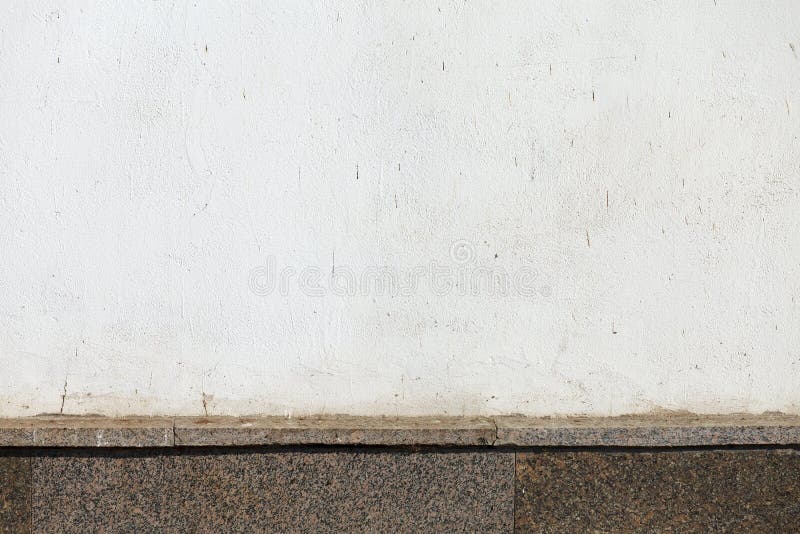 Stained White Wall with Red Granite Plinth Stock Image - Image of stone ...