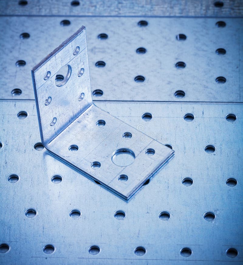 Stainless Perforated Angle Fasteners On Metallic Stock Photo - Image of ...