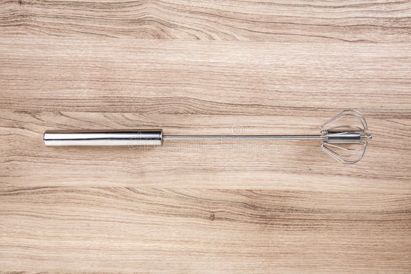 Stainless Manual Egg Beating Tool on a Wooden Cutting Board Stock Image ...