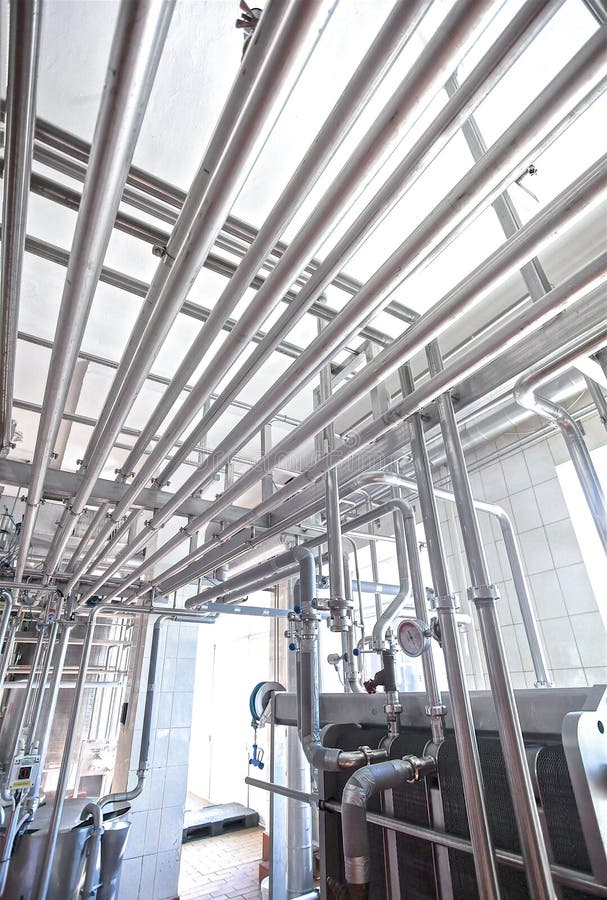 Stainless pipes in factory stock image. Image of manufacture - 118243521