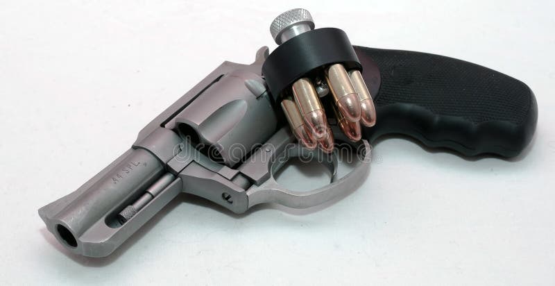 A Stainless Revolver with a Speed Loader Editorial Photo - Image of ...