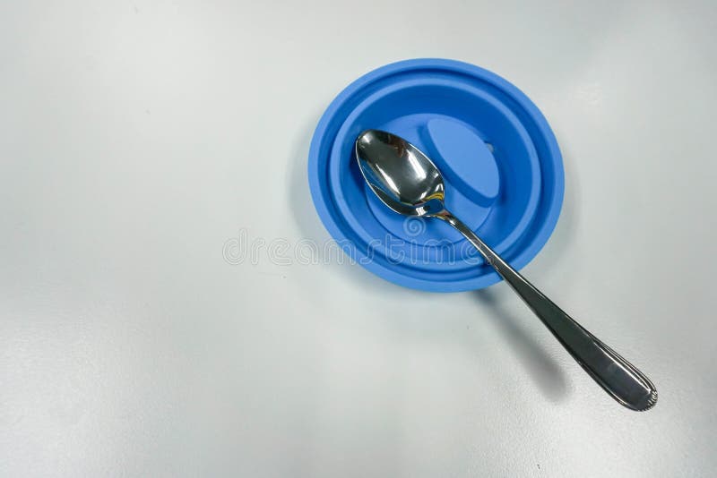 Stainless Spoon on Blue Lid Stock Photo - Image of lunch, plastic: 85901724