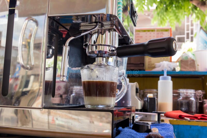 Stainless Spoon and Coffee Machine Stock Photo - Image of authentic ...