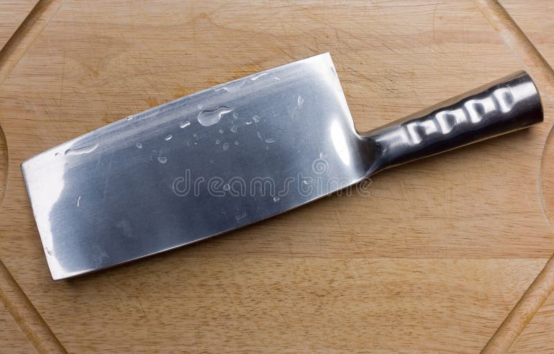 Stainless Steel Cleaver on a Cutting Board Stock Photo - Image of ...