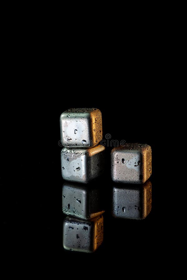 Stainless Steel Cubes Simulating Ice for Cooling Drinks on a Black ...