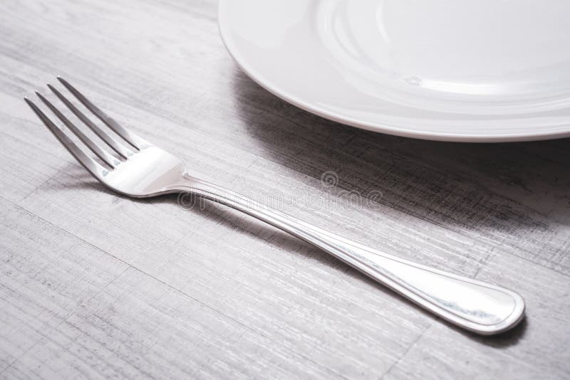 Stainless Steel Fork on a Table beside a Dinner Plate - Prepare Dinner ...