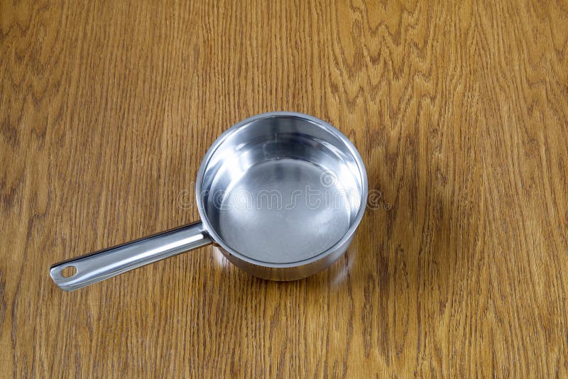 Stainless Steel Kitchen Cooking Pot on Wooden Texture Background Stock ...