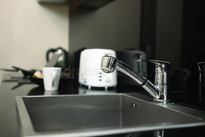 Stainless Steel Kitchen Sink and Tap Water in Modern Kitchen Stock ...