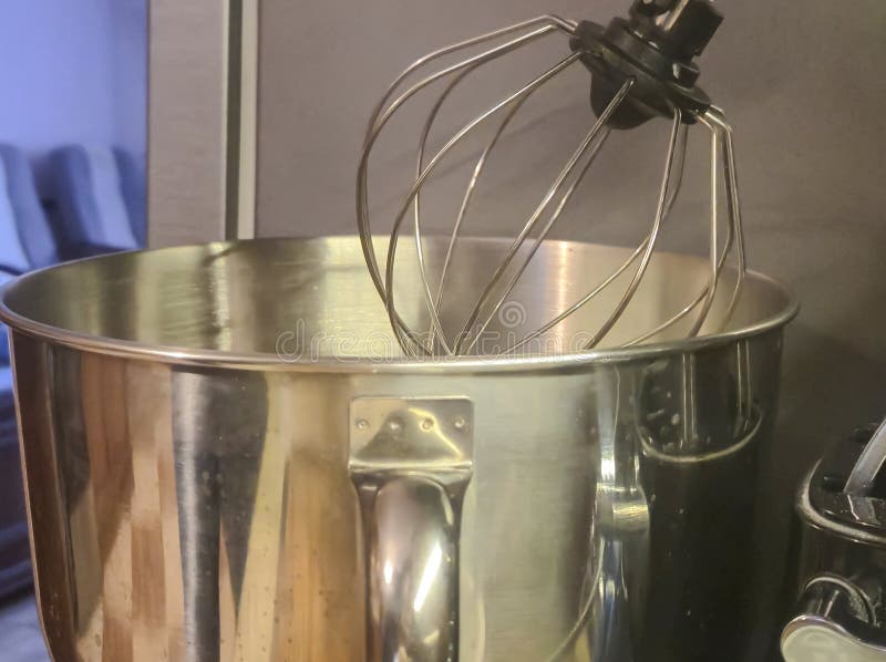 A Stainless Steel Mixing Bowl with a Whisk Inside, Ideal for Baking ...
