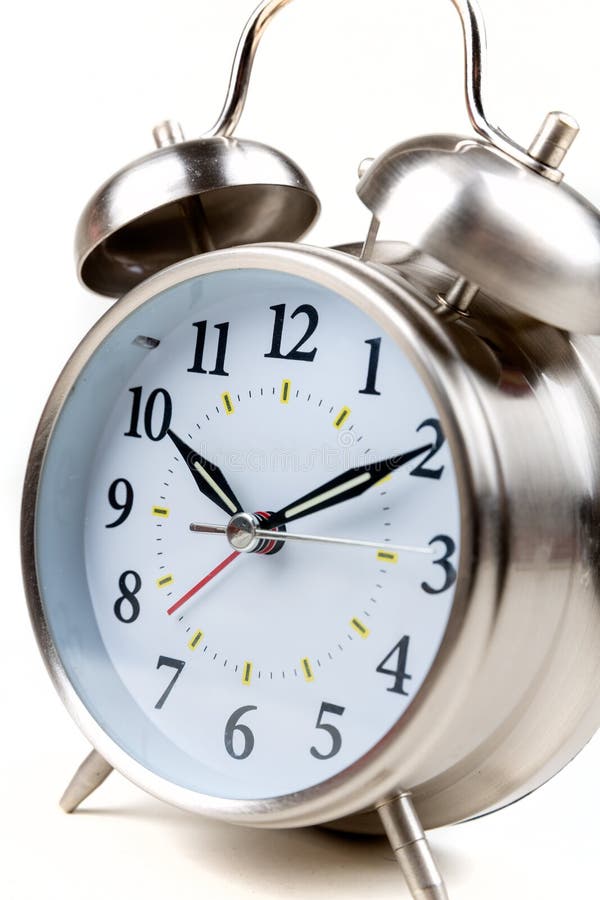 Stainless Steel Old Fashioned Alarm Clock on a White Background Stock ...