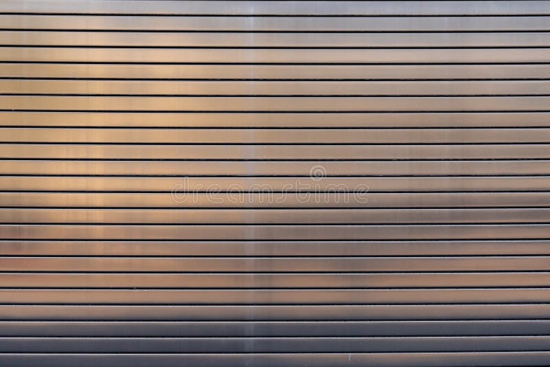 Stainless Steel Overhead Door Reflecting Warm Light of Sun Texture ...