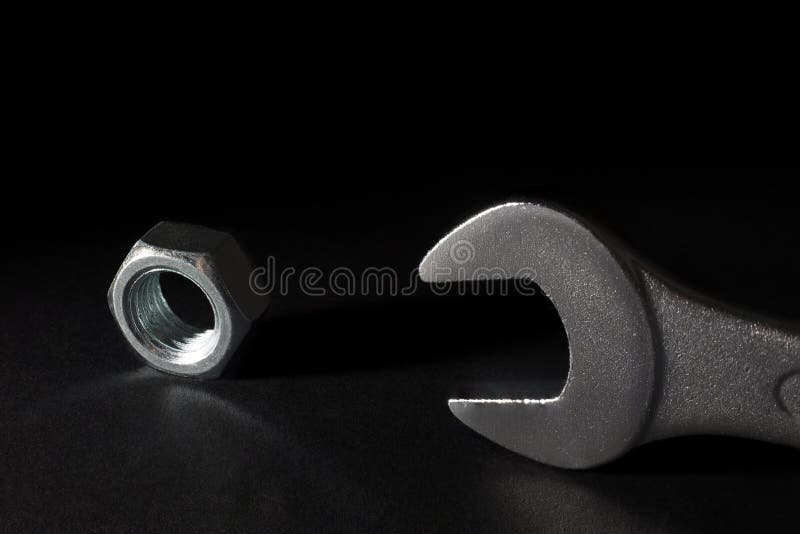 Stainless Steel Spanner and Nut on Black Stock Photo - Image of chrome ...