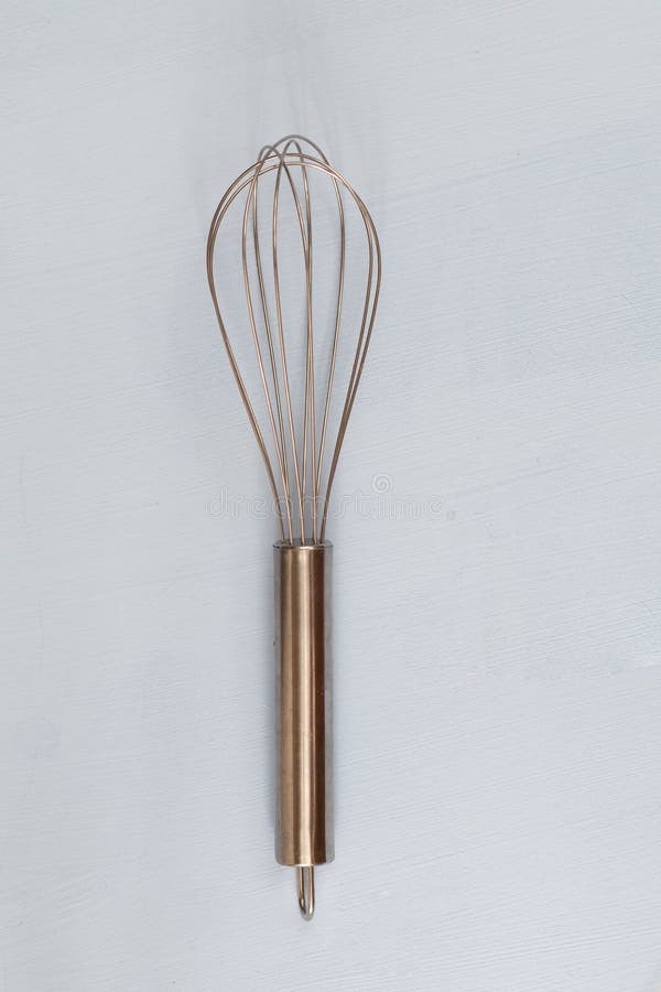 Stainless Steel Whisk on Light Blue Background Stock Image - Image of ...