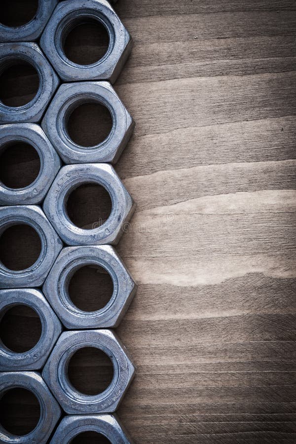 Stainless Threaded Construction Nuts on Vintage Wooden Board Con Stock ...