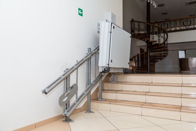Stair Lift for the Disabled. Stairs of Public Building Stock Photo ...