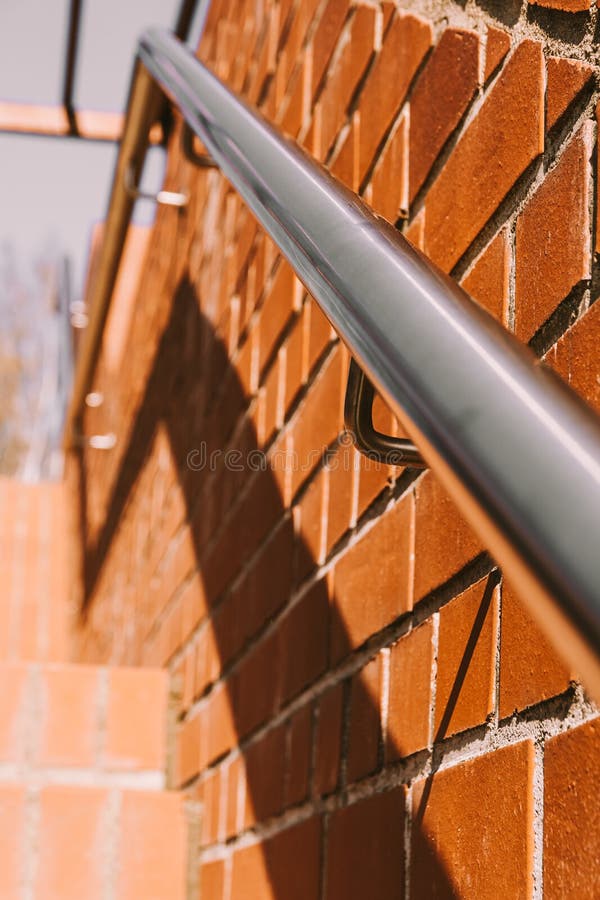 Stair Railing on a Brick Wall in Close-up Stock Photo - Image of brick ...