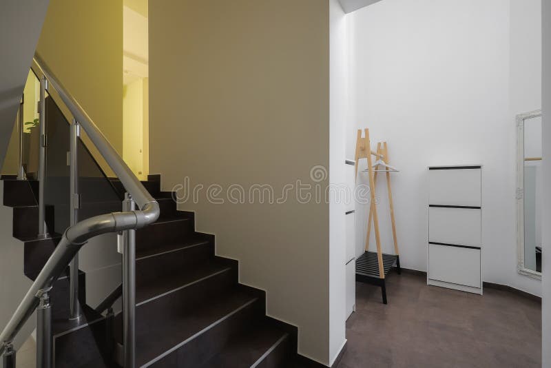 Staircase with Brown Tiles and Light Walls Inside the House Stock Image ...