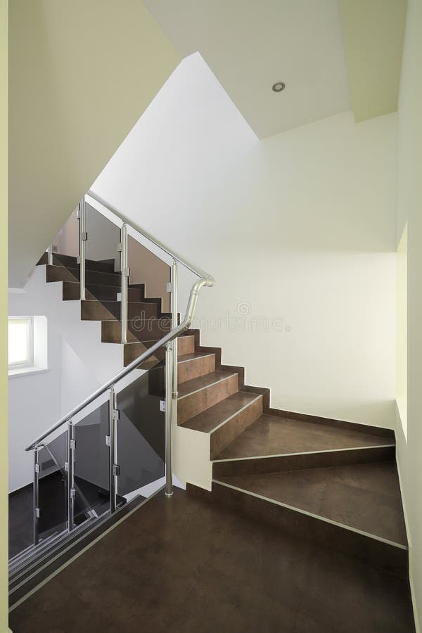 Staircase with Brown Tiles and Light Walls Inside the House Stock Photo ...