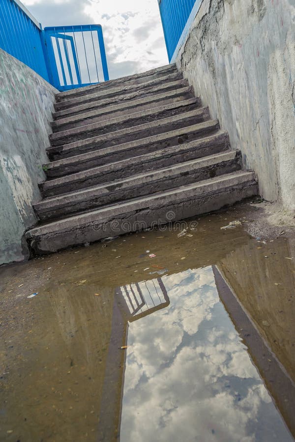 Staircase Coming Out of a Puddle Stock Photo - Image of doors ...