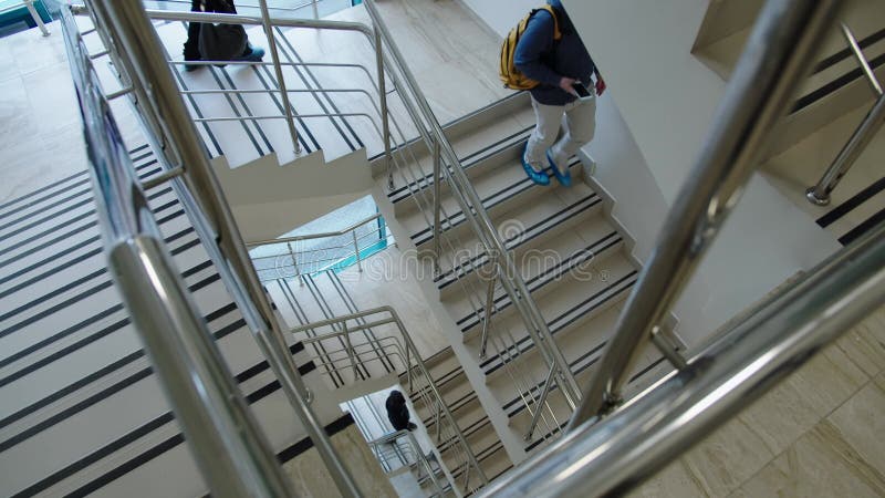 Staircase Down in an Office Building with Chrome Railings that People ...
