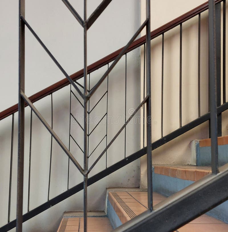 The Staircase Railing is Decorated with Wrought Iron Stock Photo ...
