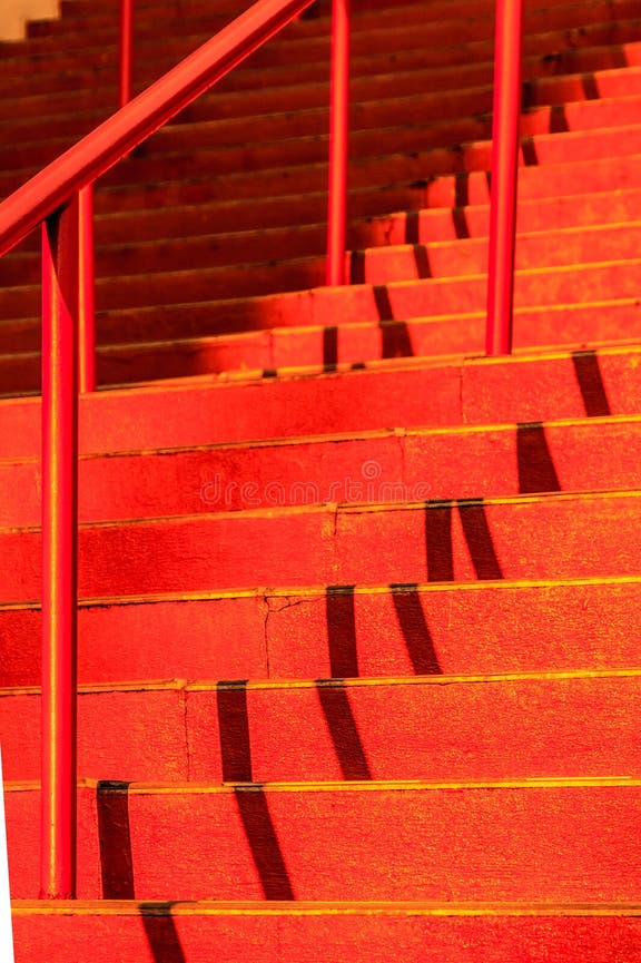 A Staircase with Red Steps and a Red Railing Stock Photo - Image of ...