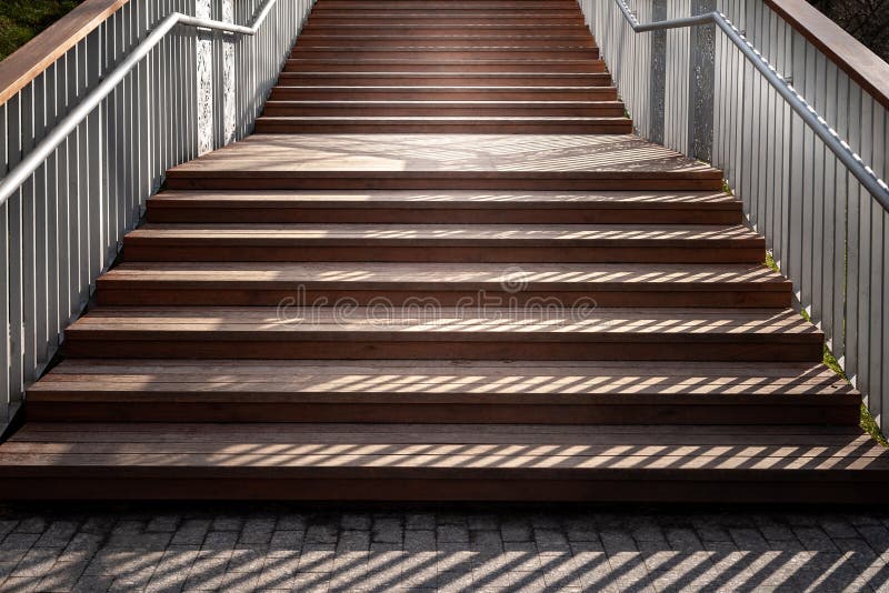 Staircase with a Shadow. Staircase with Wooden Steps and Metal Railing ...