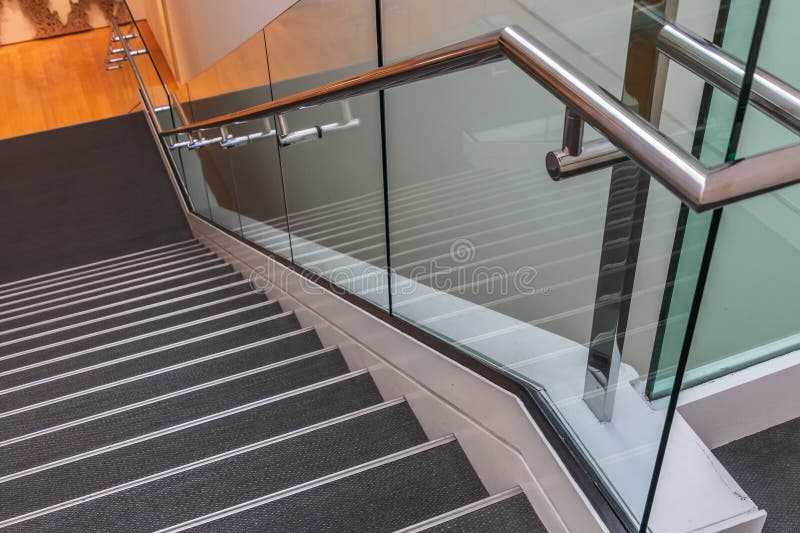 Stairs Going Down with a Silver Rail Stock Image - Image of moder ...