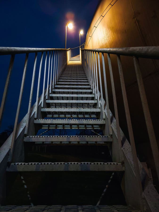 Stairs Lit Up at Night Under an Overpassed Sky Stock Photo - Image of ...