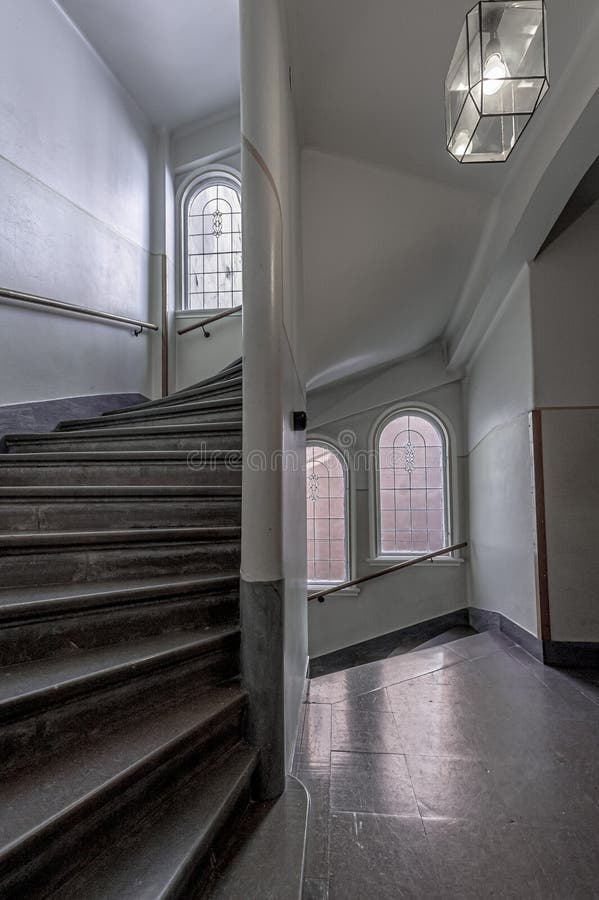 Stairs in an Old Building with Rounded Windows To the Backyard Stock ...