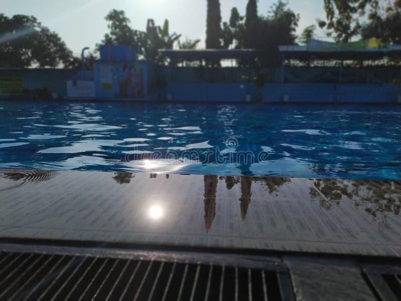 Stairs in the Pool with Sun Exposure Stock Image - Image of pool, light ...