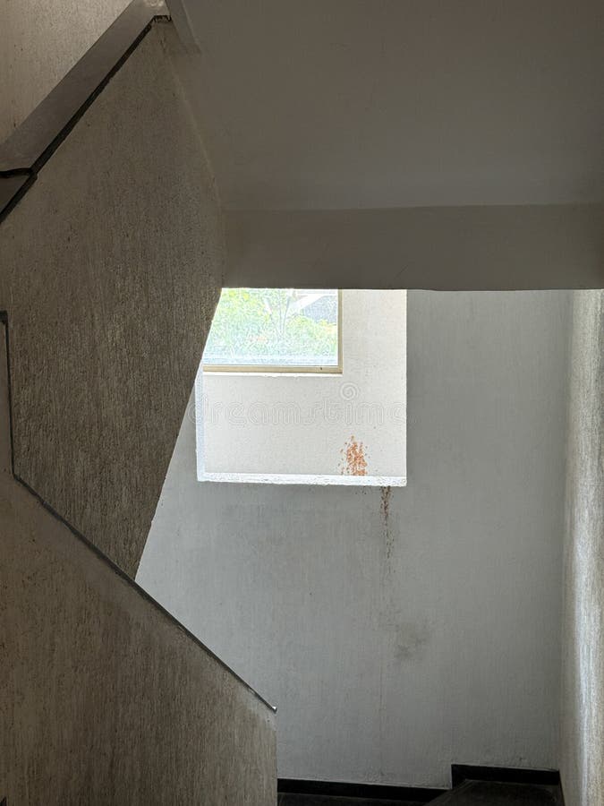 A Stairway with a Window in the Middle Stock Image - Image of building ...