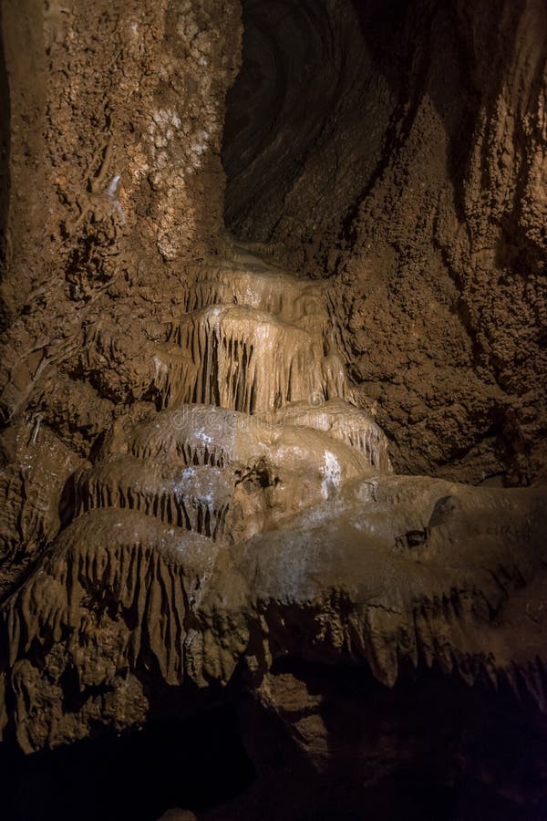 A Big Stalactite is Hanging from the Rock Stock Image - Image of group ...