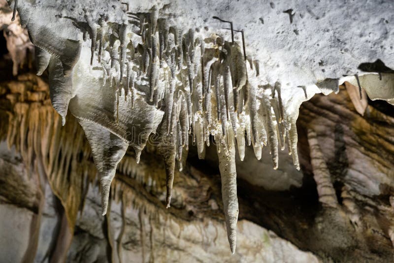 Stalactites in the cave stock photo. Image of underground - 127776976