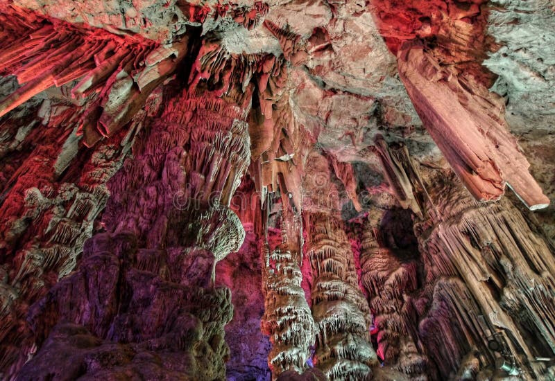 Stalactites on the Ceiling of the Cave Red Light Stock Photo - Image of ...