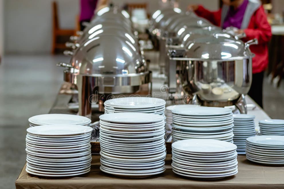 Stalks of Plain White Plates on Top of Buffet Table. Stack of White ...
