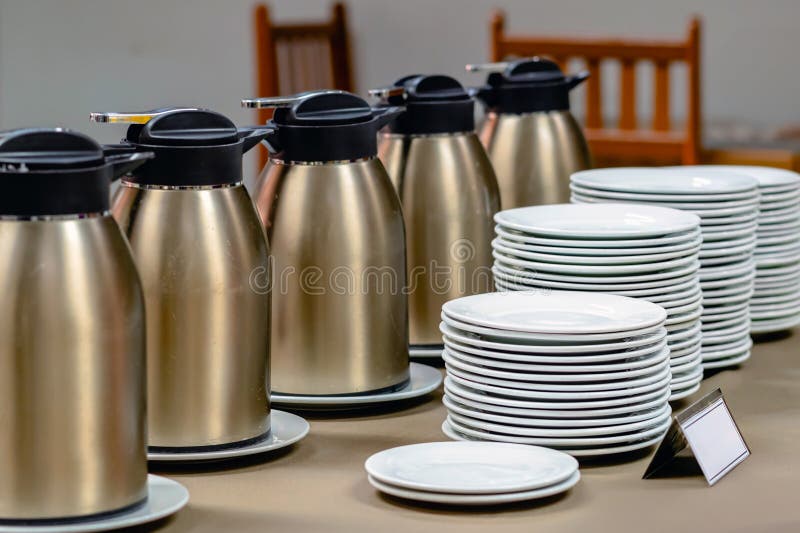 Stalks of Plain White Plates on Top of Buffet Table. Stack of White ...