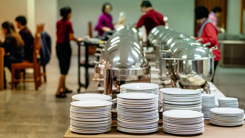 Stalks of Plain White Plates on Top of Buffet Table. Stack of White ...
