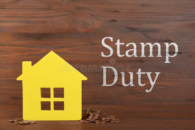 Stamp Duty. House Model and Coins on Wooden Background Stock Image ...