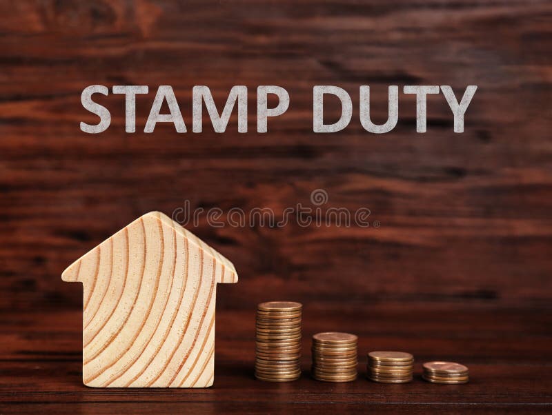 Stamp Duty. House Model and Coins on Wooden Background Stock ...